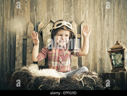Happy kid playing in pilot helmet pretend to be aviator. Travel ...