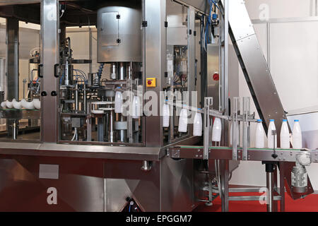 Packaging milk bottles line Stock Photo - Alamy