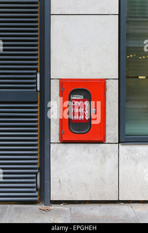 Dry riser red inlet box and sign at wall Stock Photo - Alamy