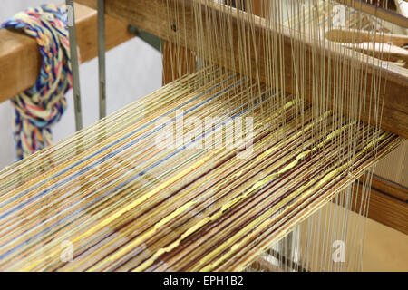 Colorful threads on a loom for traditional Panja dhurrie weaving ...