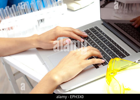 Microbiology scientist typing on keyboard works with green chroma key ...