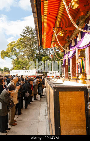 New year in Japan. Many people in front of the main stage of the hall ...