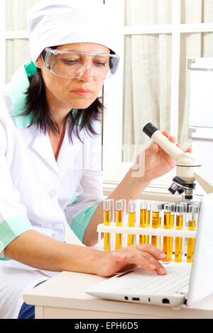 Female researcher analyzing molecular structure at chemistry lab Stock ...
