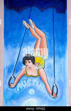 Wall art of a lady circus performer on the rings Stock Photo - Alamy