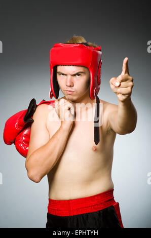 Angry boxer against grey background Stock Photo - Alamy