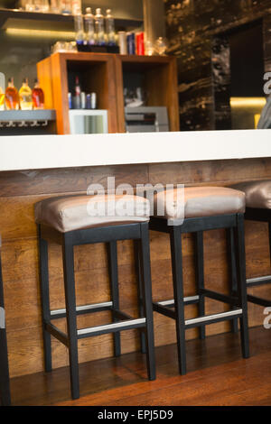Close up of several bar stool Stock Photo - Alamy