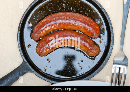 beef sausages cooked on iron skillet Stock Photo - Alamy