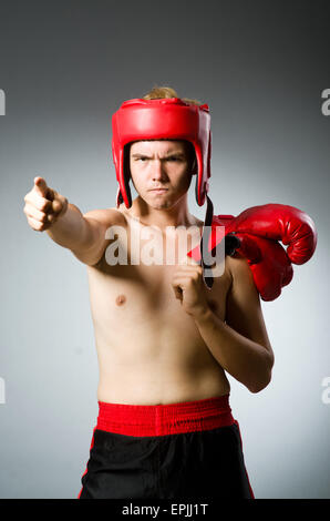 Angry boxer against grey background Stock Photo - Alamy