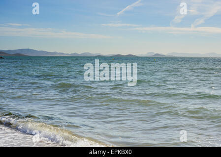 Mar Menor sea with waves, blue sky and mountains Stock Photo - Alamy