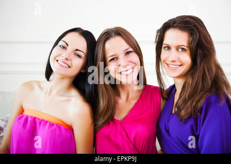 Three happy teen girls posing in front of strong vertical lines Stock ...