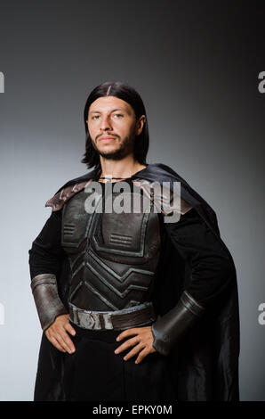 Angry warrior against dark background Stock Photo - Alamy