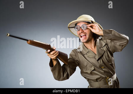 Funny safari hunter with rifle Stock Photo - Alamy