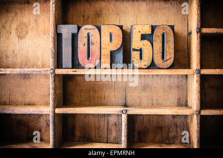 The word 50/50 written in vintage wooden letterpress type in a wooden ...