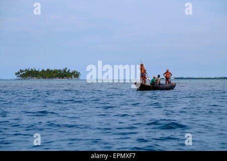 Men from the Guna people with a Cayuko hand-built dugout canoe in the ...