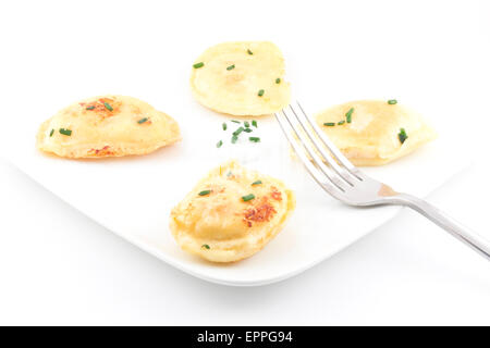 Delicious authentic Polish pierogies with chives and sour cream Stock ...
