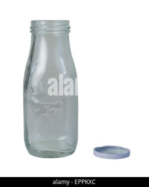 Jar with milk and vintage bottle of milk on white wooden table ...