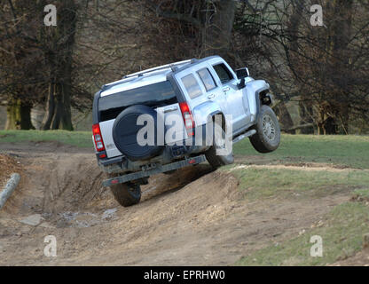 Hummer H3 driving off road splashing through deep water Stock Photo - Alamy