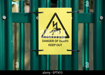 Danger of death and electrocution. Triangular electricity warning sign ...