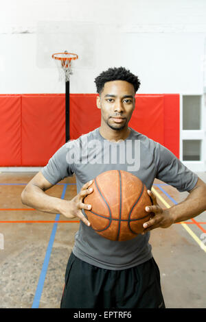 Attractive afro-american basketball player inside a gymnasium Stock ...