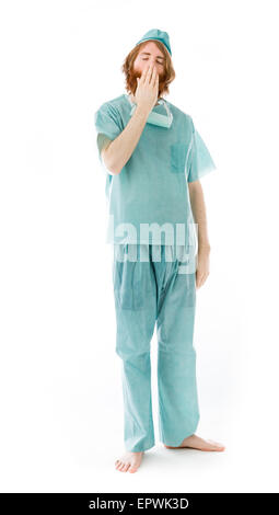 Sleepy doctor yawning on isolated background. Tired of working doctor ...