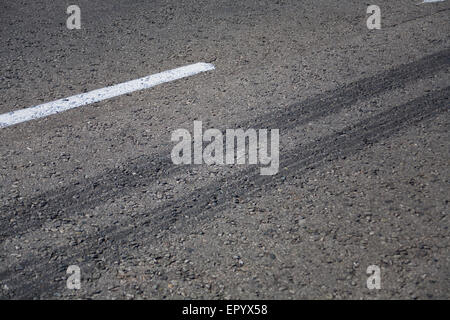 Skid marks on tar road Stock Photo - Alamy