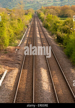 A railway track stretches out into the distance with electrified ...
