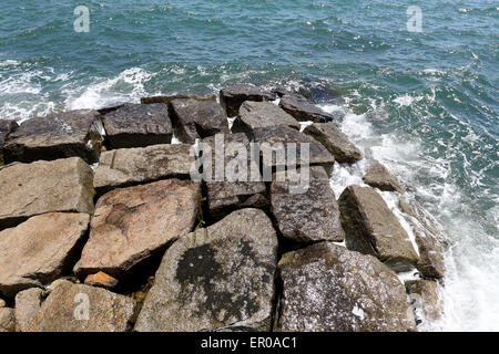 Stone breakwater seawall for protection of coast Stock Photo - Alamy