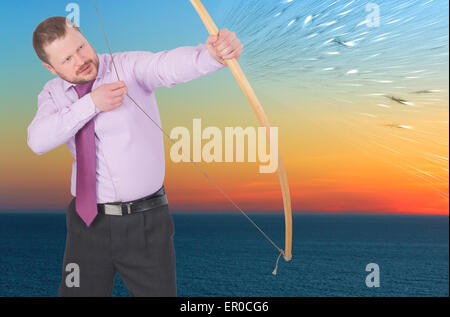 Businessman practicing archery and sunset background archer bow Stock ...