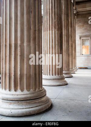 A museum building with classical columns and a pediment relief displays ...
