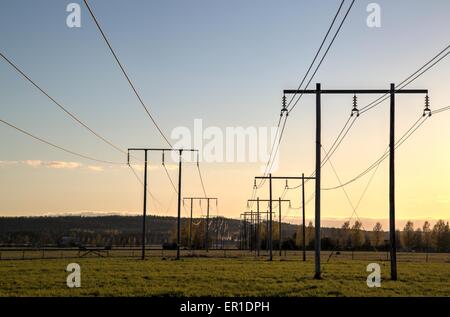 Electricity Pylons Trailing Away in Field. Power-transmission poles in ...