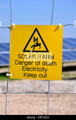 Solar farm danger warning sign Stock Photo - Alamy