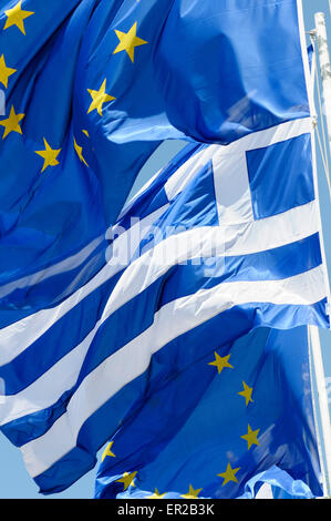 The flag of Greece flies in the blue sky. National holiday Stock Photo ...