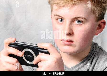 Boy with psp Stock Photo - Alamy