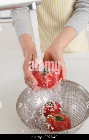 Women washing cooking utensils in a river, Tamil Nadu, India Stock ...
