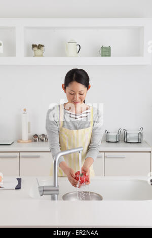 Women washing cooking utensils in a river, Tamil Nadu, India Stock ...