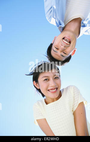 The blue sky and a smiling Japanese woman Stock Photo - Alamy