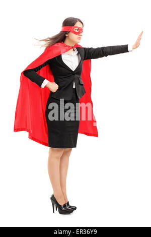 Female superhero making a stop sign with her hand isolated on white ...