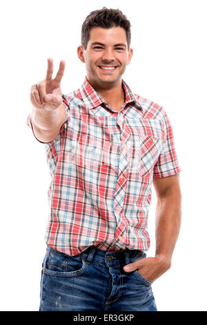 Handsome hispanic man standing over white background puffing cheeks ...
