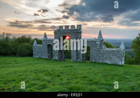 Stone folly arches at sunset Stock Photo - Alamy