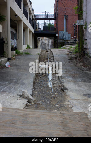 repair of a broken and damaged paved road, the road has many defects ...