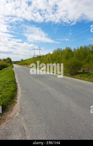 straight road with electric lines Stock Photo - Alamy