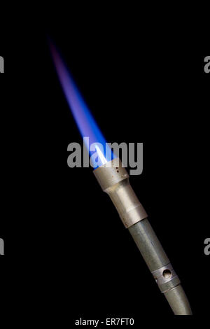 Blue flame torch soldering a brass diverter for shower bathtub Stock ...