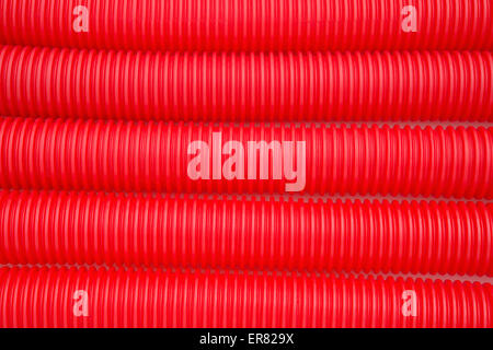 Red plastic pipes Stock Photo - Alamy
