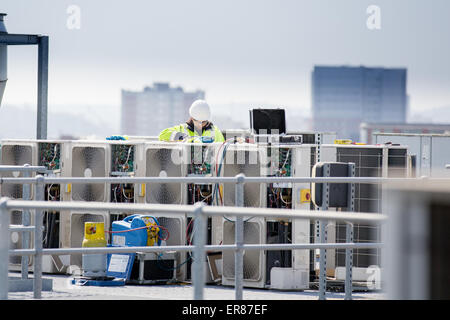man working on air conditioning unit Stock Photo - Alamy