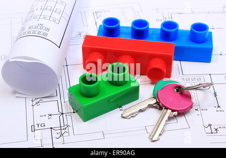 Home keys, plastic building blocks and electrical diagrams lying on ...