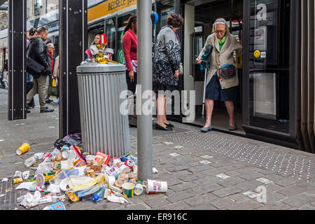 Overfull garbage can with piled up household refuse due to strike by ...