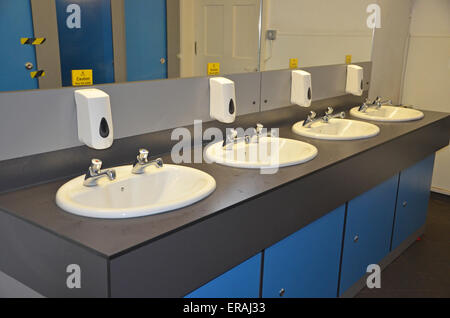 A row of sinks in a public washroom bathroom, restroom, latrine ...