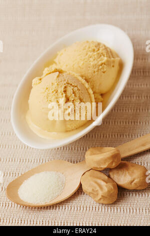 Salted caramel cream on spoon, white background, Germany Stock Photo ...