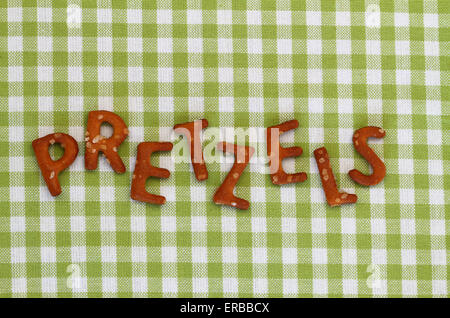 Word pretzels written with pretzel-like letters on checkered cloth ...