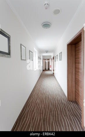 hotel hallway with many doors Stock Photo - Alamy